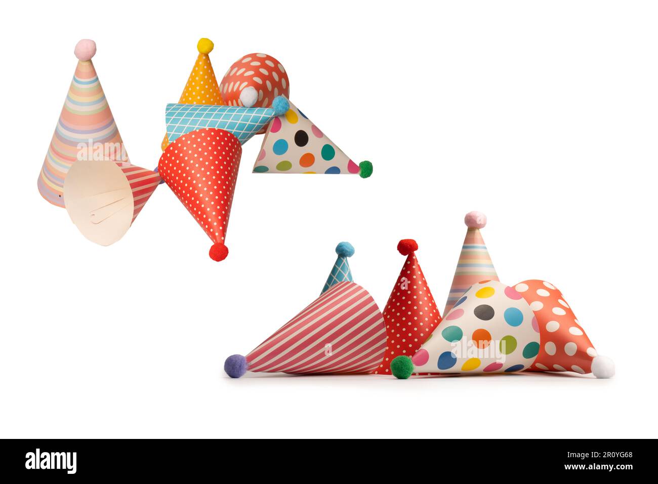 A group of bright and colorful birthday caps isolated on a white ...