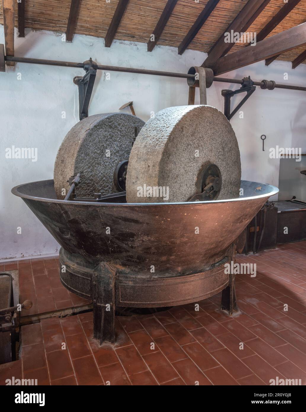 Olive oil press is installed in premises of the ancient equipment for ...