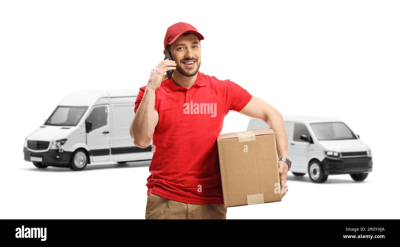 Delivery man with a van holding a package and using a mobile phone ...