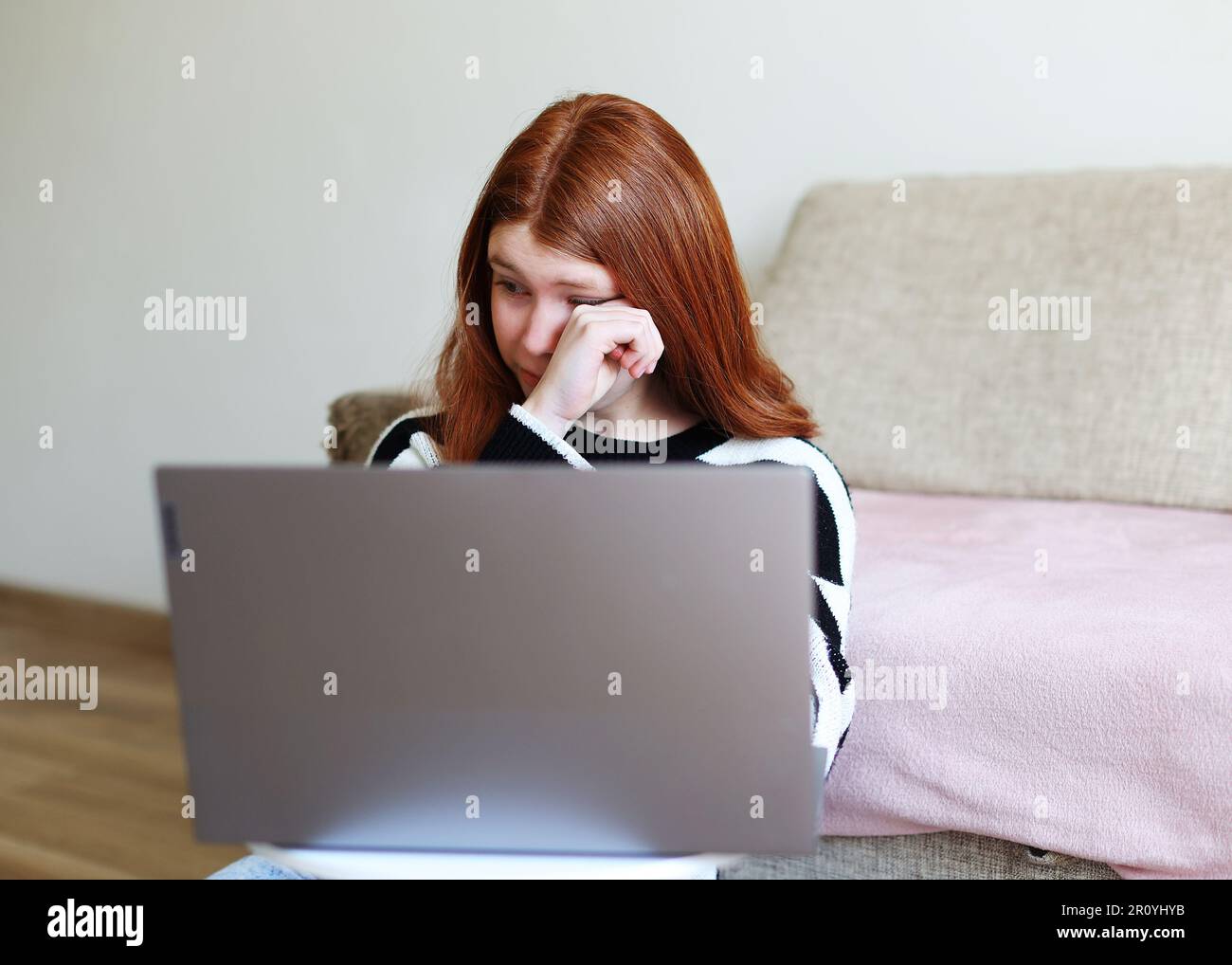 Nervous teenager doing homework at the table in home Stock Photo - Alamy