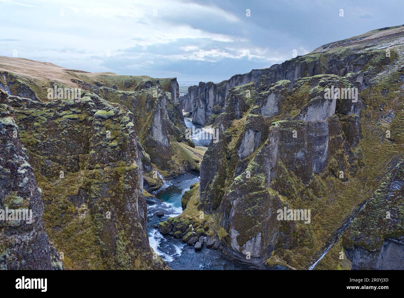 View of a majestic waterfall in the distance, with a rocky mountain ...