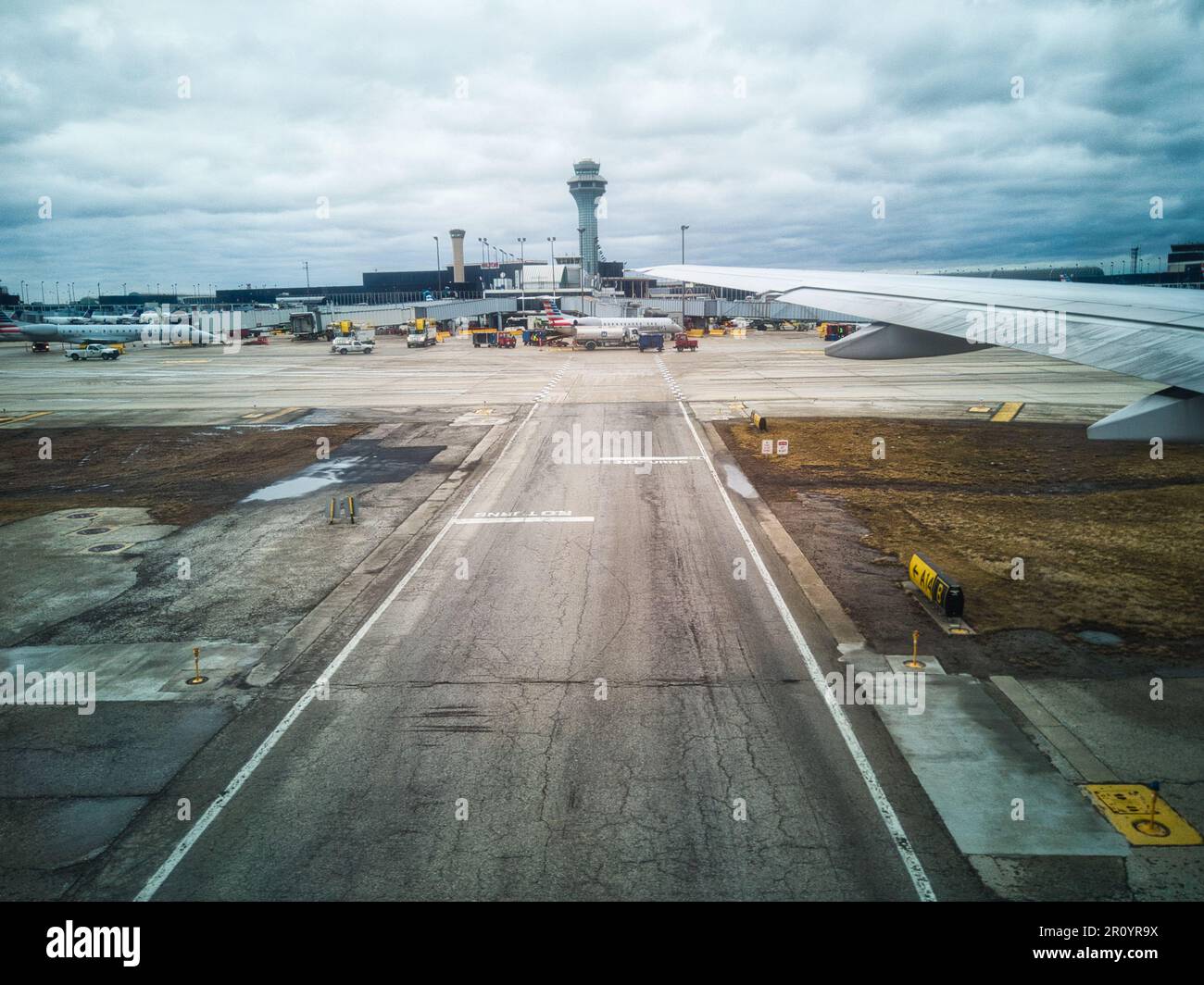 A view from a plane window looking down onto a commercial airport ...
