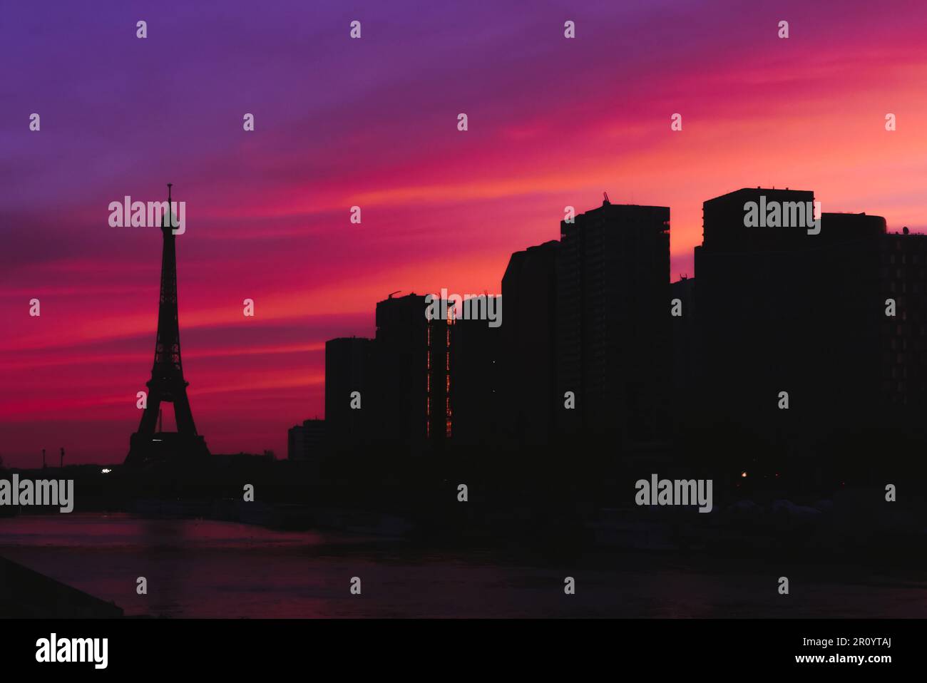 View on the Eiffel tower with group of modern buildings in front of the ...