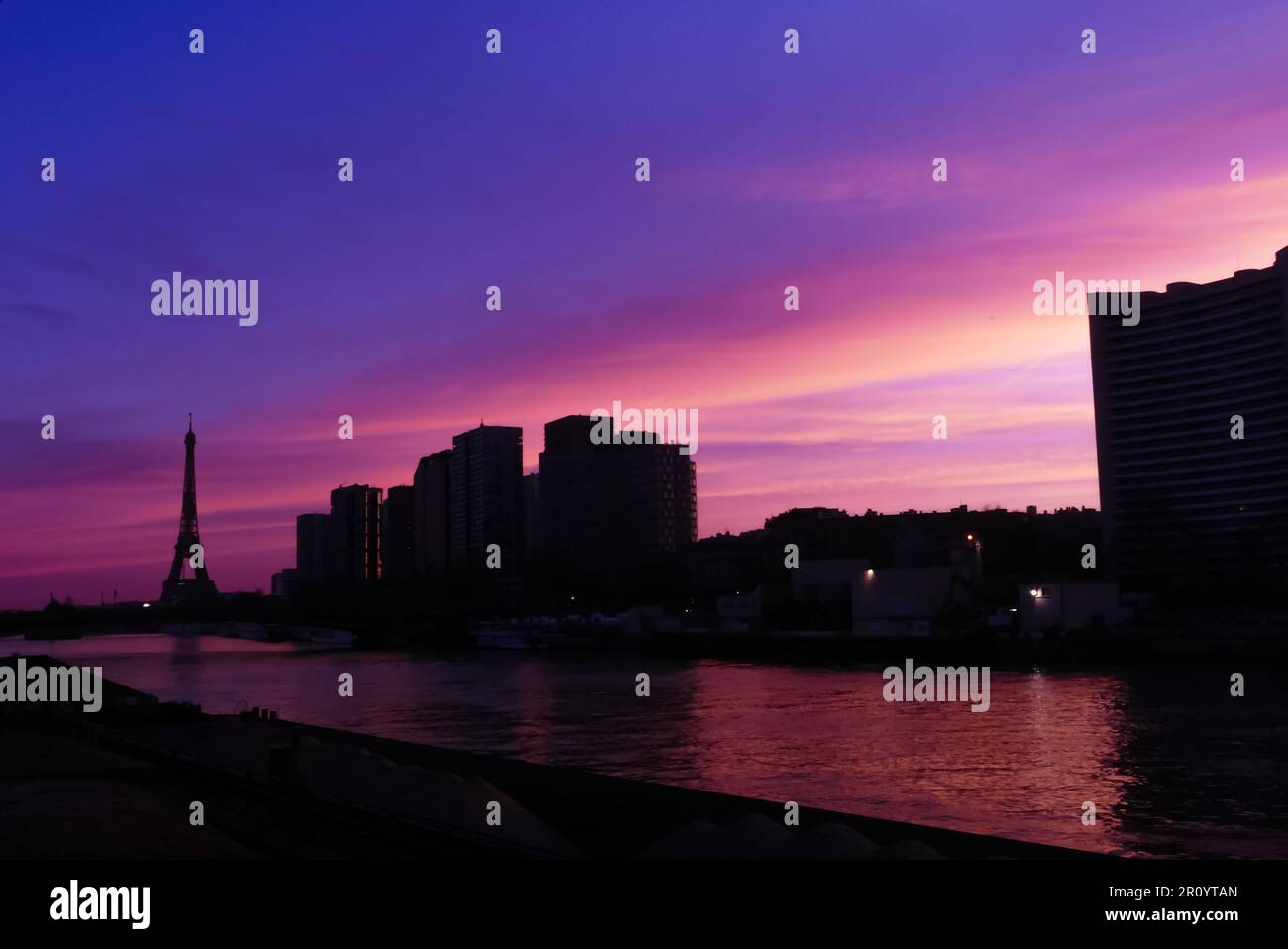 View on the Eiffel tower with group of modern buildings in front of the ...