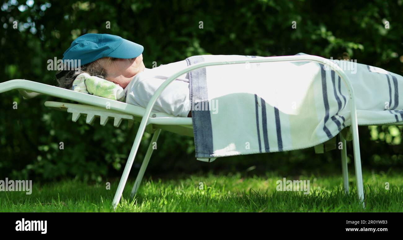 Person napping in park hi-res stock photography and images - Alamy