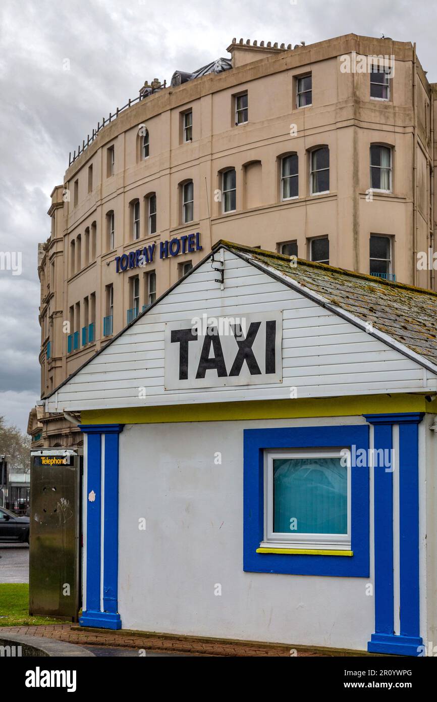 Wooden Taxi hut with Torbay Hotel behind. Torquay, Devon Stock Photo ...