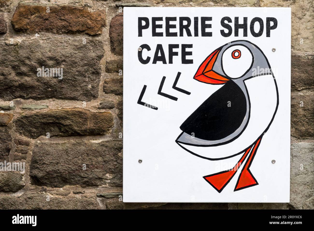 A picture of a puffin on the sign for the Peerie Shop Cafe in Lerwick ...