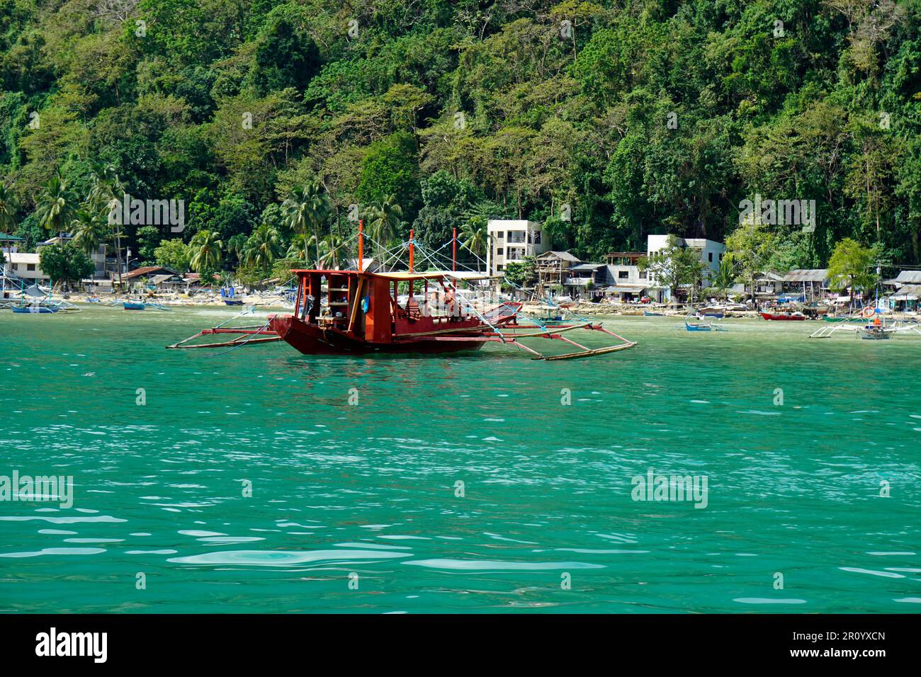 wooden traditional outrigger boats on palawan island at the philippines ...