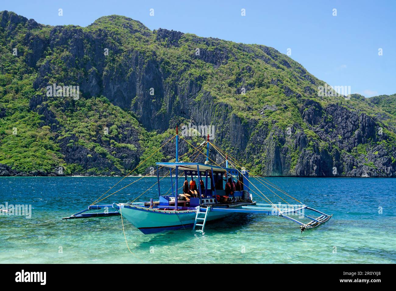 wooden traditional outrigger boats on palawan island at the philippines ...