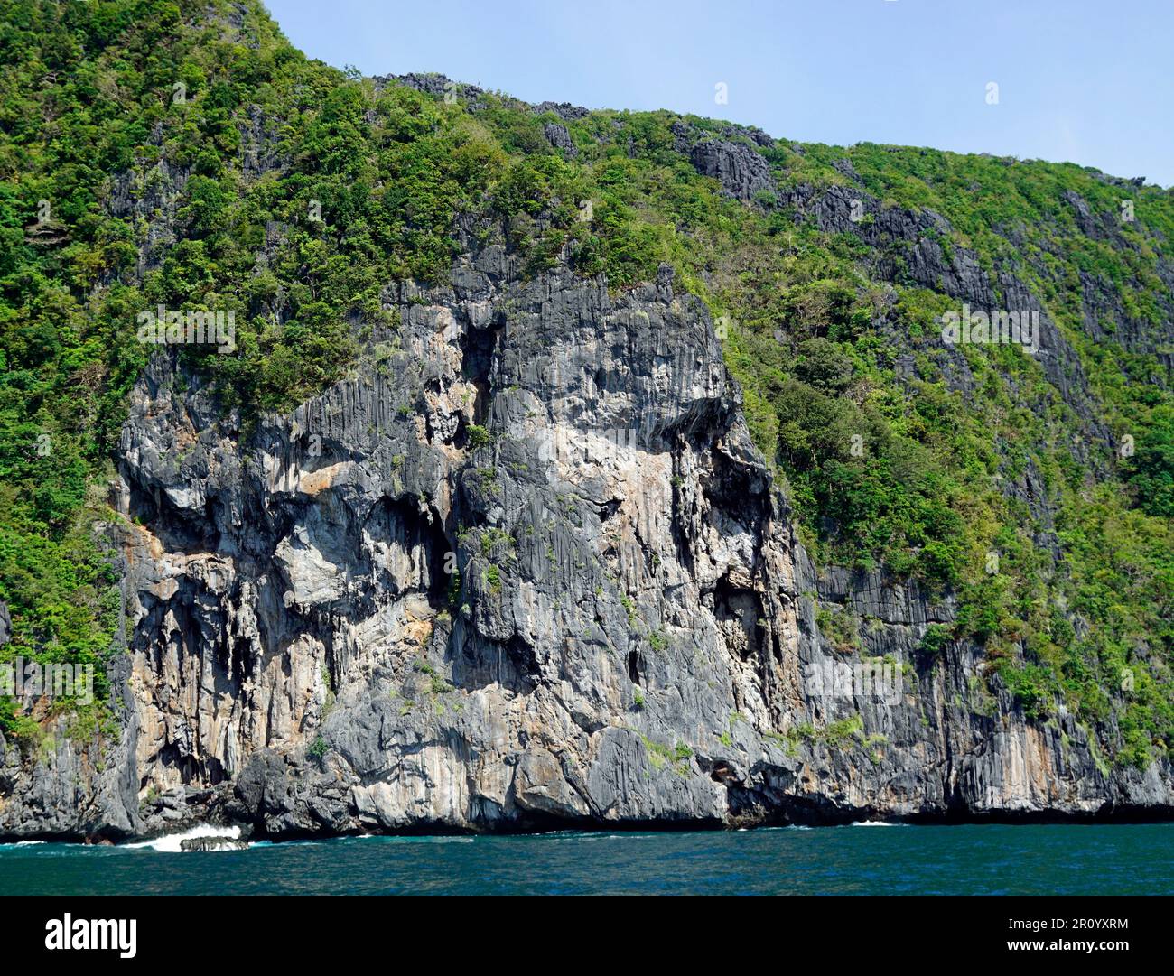 massive limestone rocks in the blue sea at the el nido archipelago ...