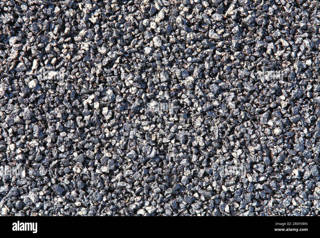 New asphalt surface, background. Detailed texture of fresh bitumen ...