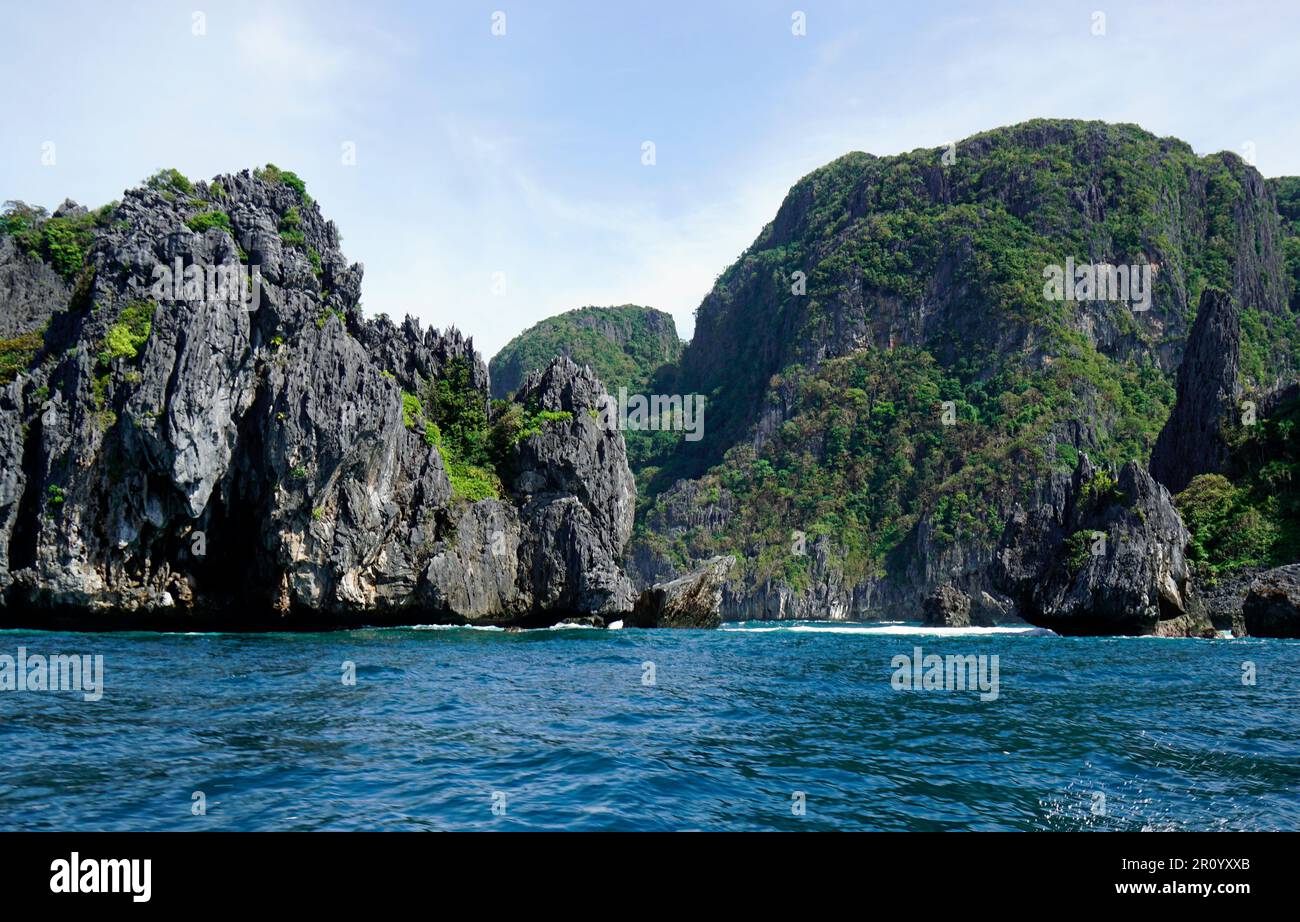 massive limestone rocks in the blue sea at the el nido archipelago ...