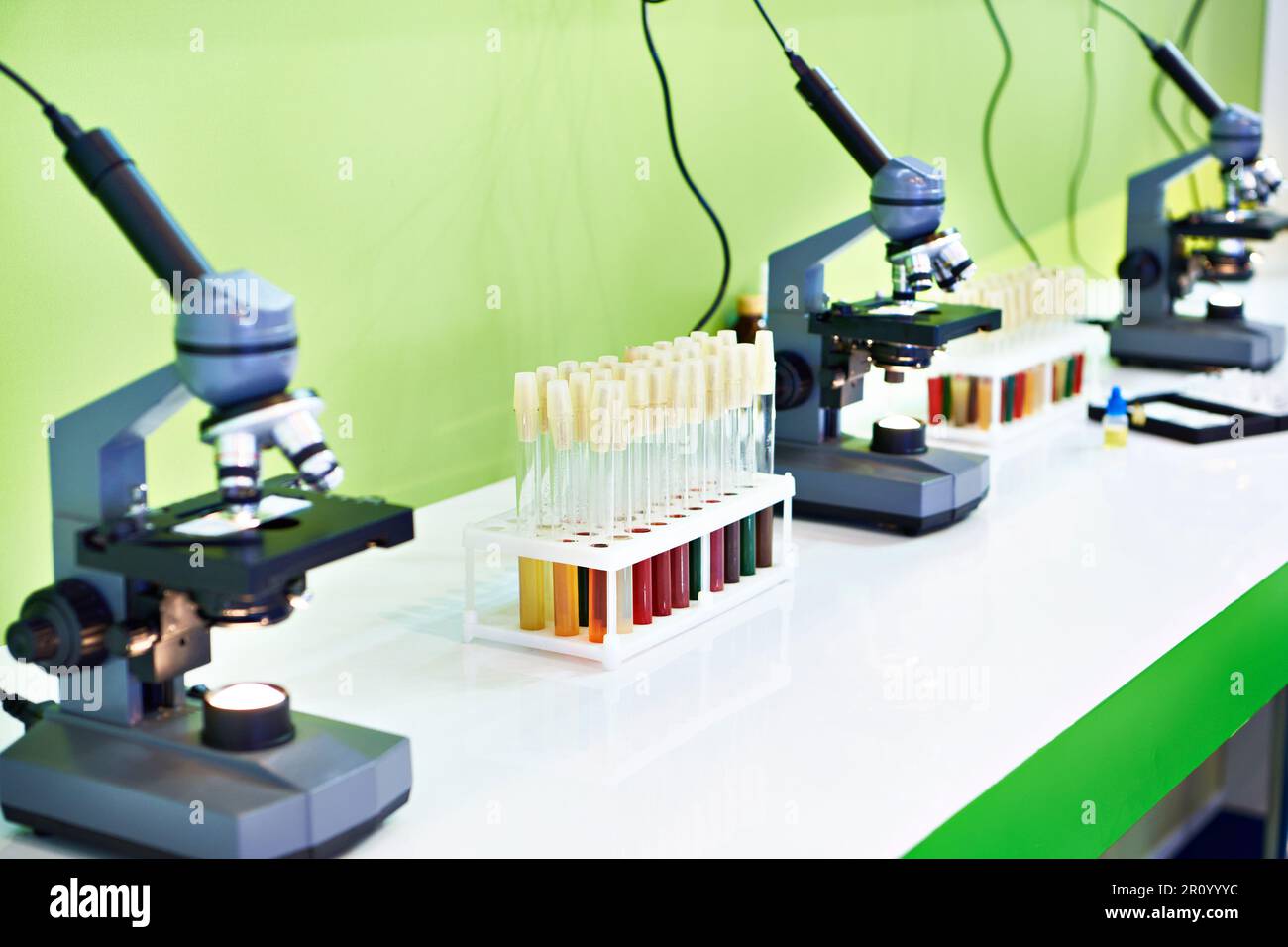 Medical microscopes and samples of biofluids in test tubes Stock Photo ...