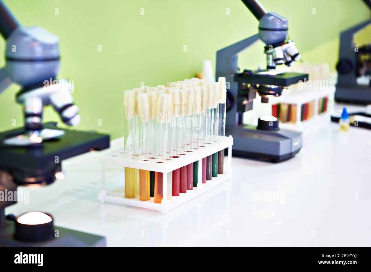 Medical microscopes and samples of biofluids in test tubes Stock Photo ...