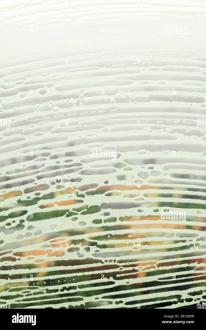 Soap foam on the window. Blurred view of abstract texture of soap ...