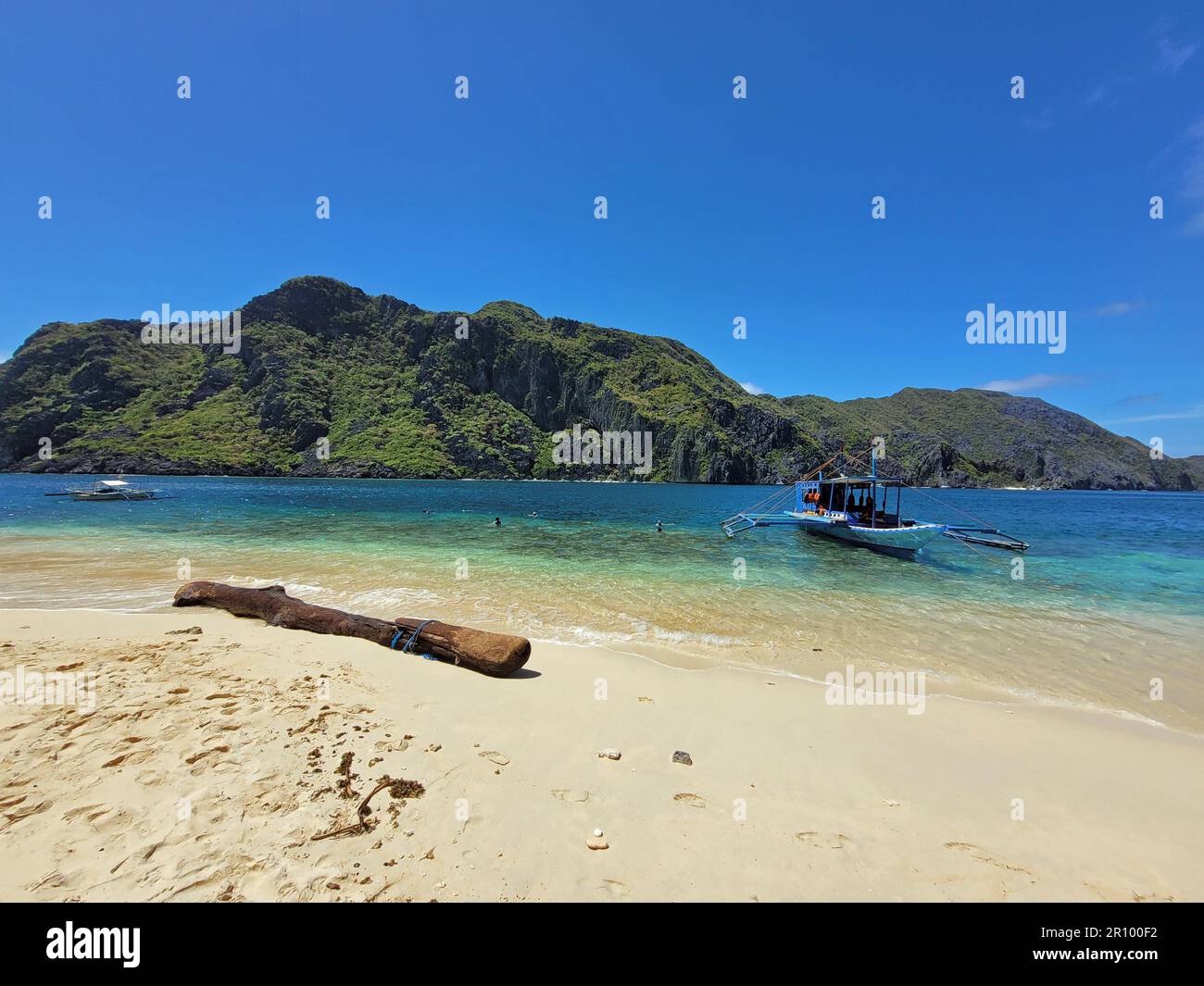 wooden traditional outrigger boats on palawan island at the philippines ...