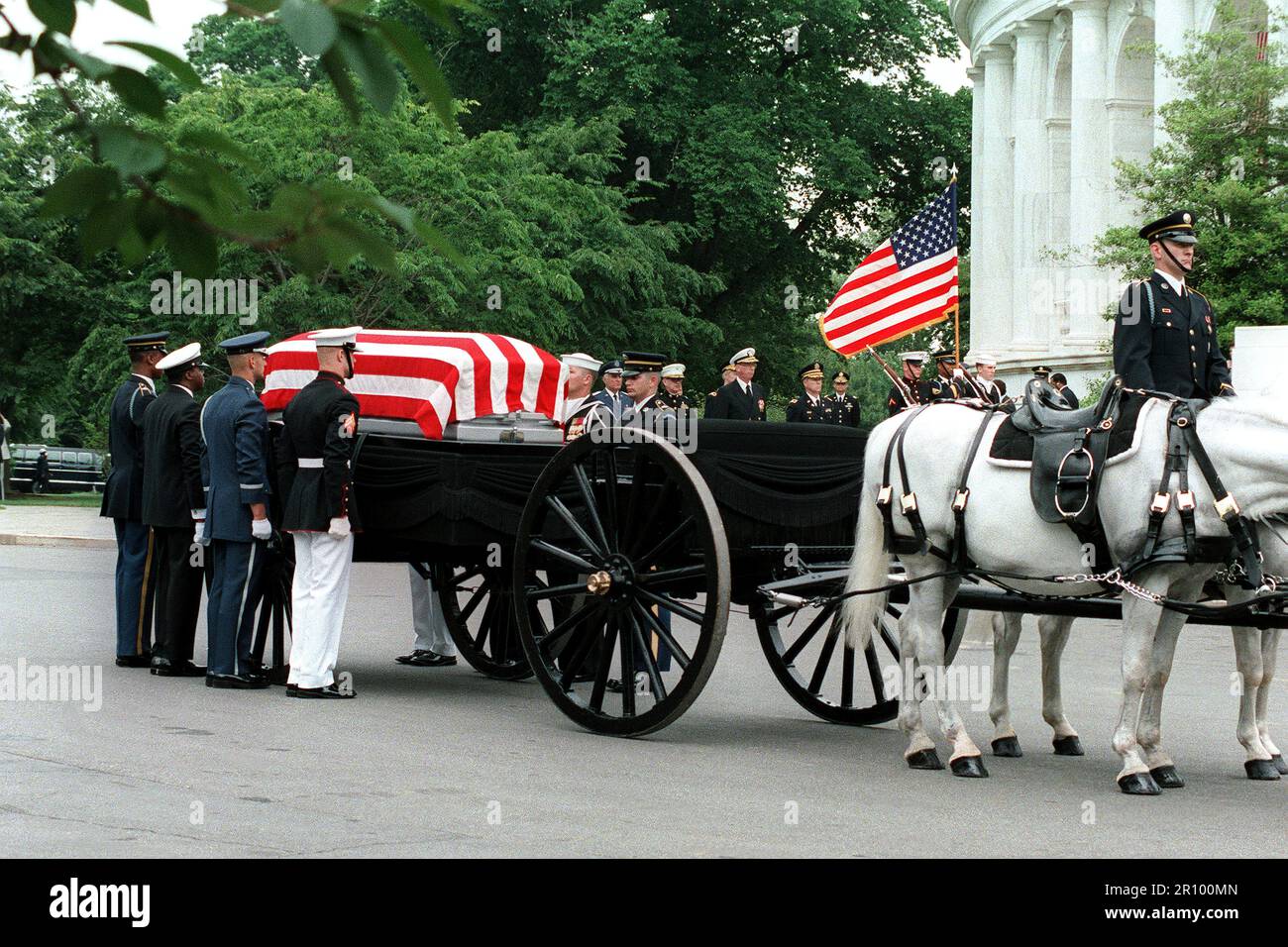 A joint services casket team prepares to carry the casket of the Unknown Serviceman of the ...