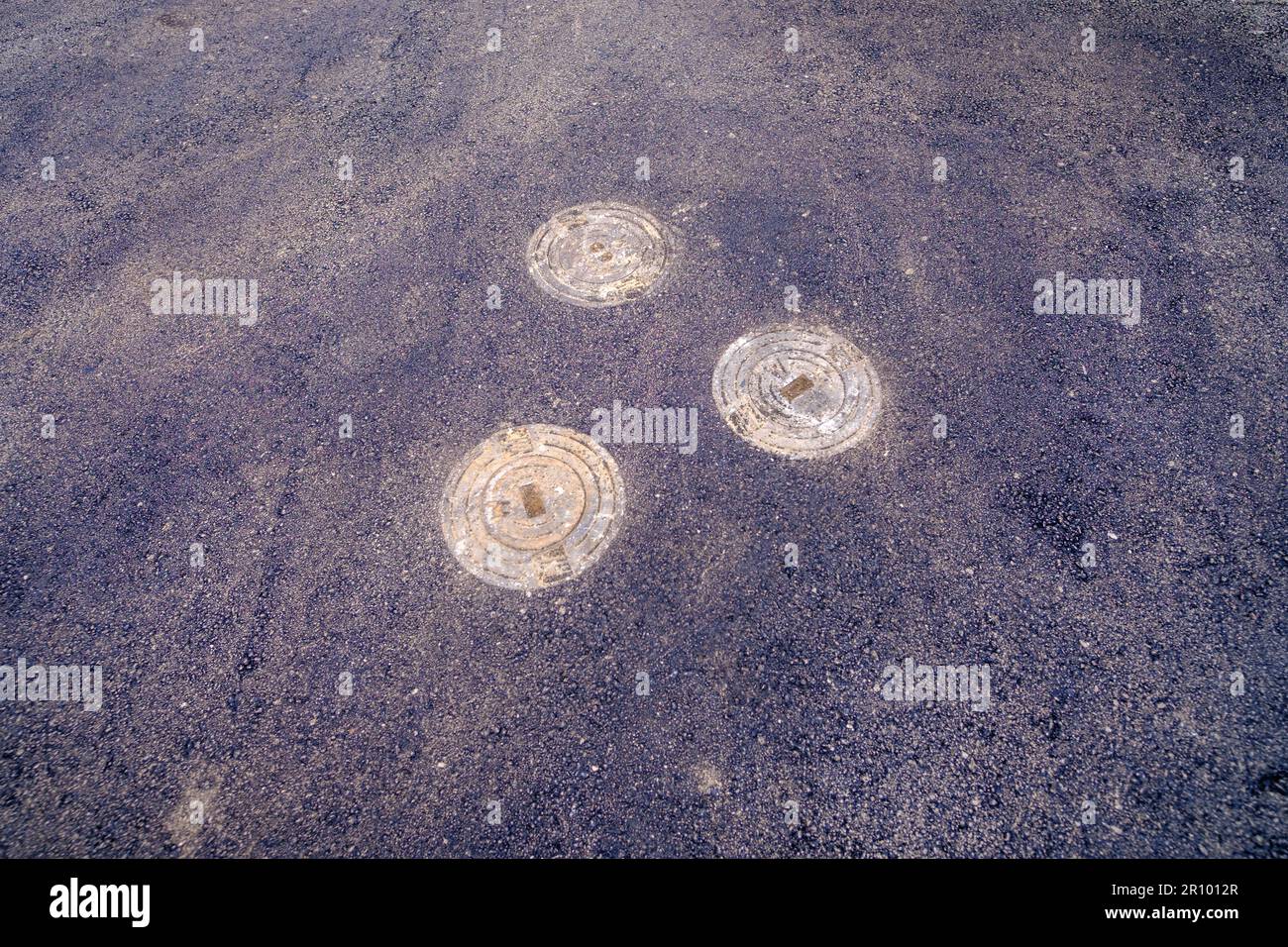 Three small checkpoints on the asphalt road of the city Stock Photo - Alamy