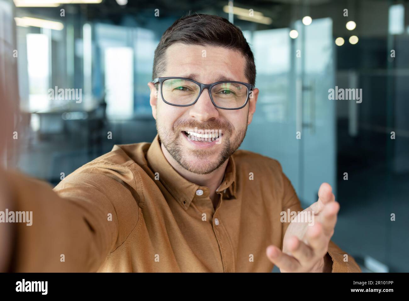 Young employee in glasses talks hi-res stock photography and images - Alamy