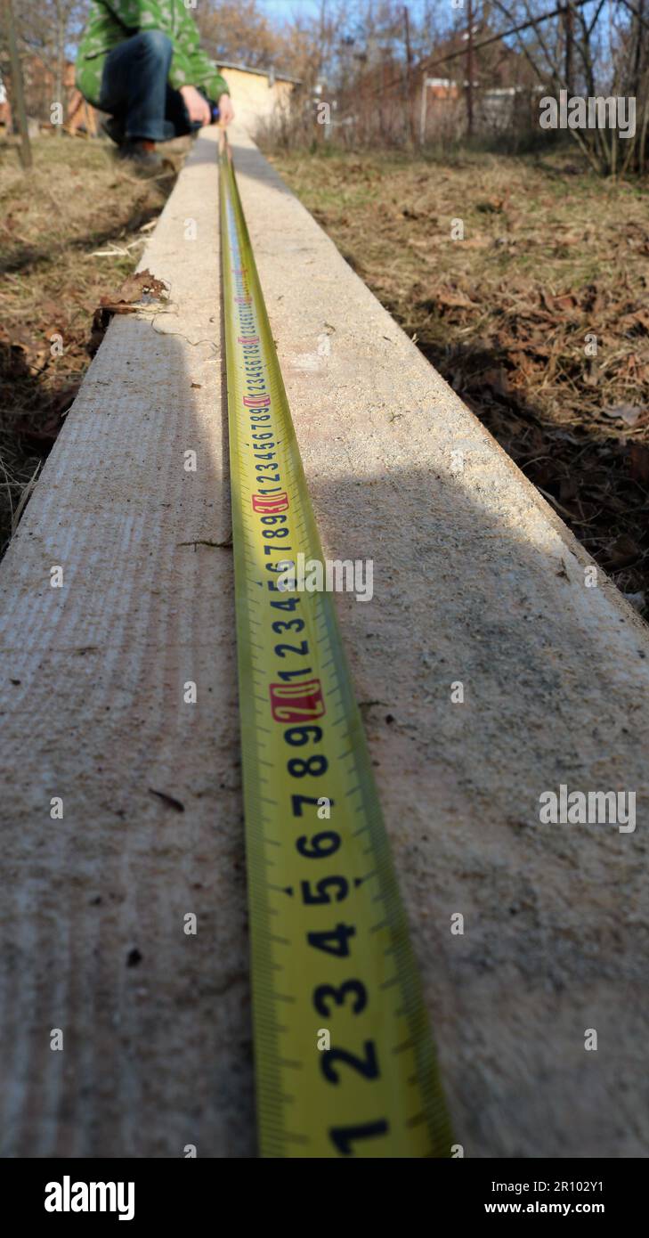 vertical shot with an example of using a tape measure in centimeters ...