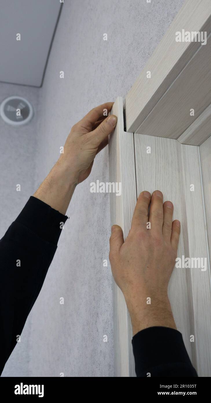 fixing the closing strips on the door frame at the completion of the ...