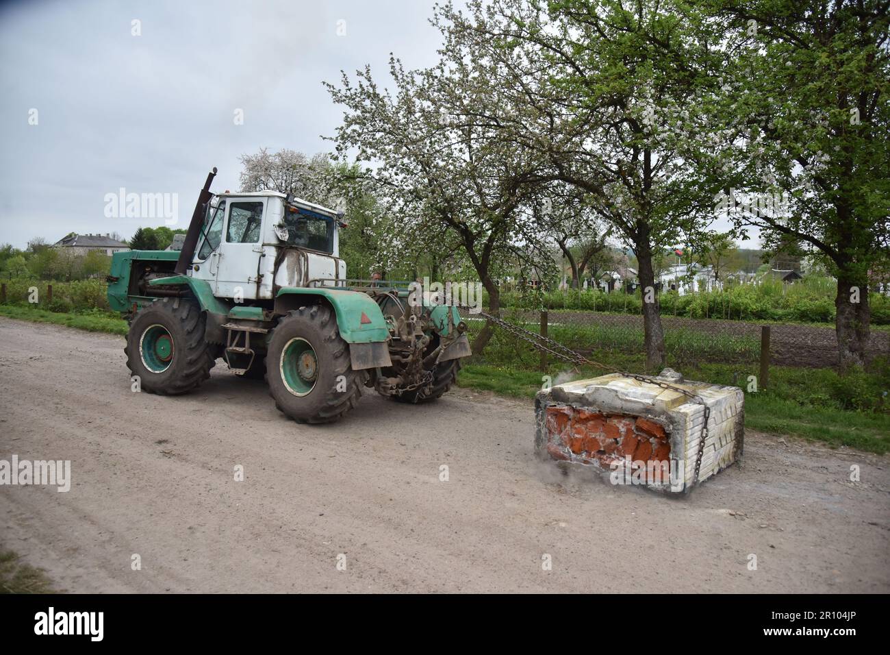 A tractor pulls the Soviet monument dedicated to the victory of the ...