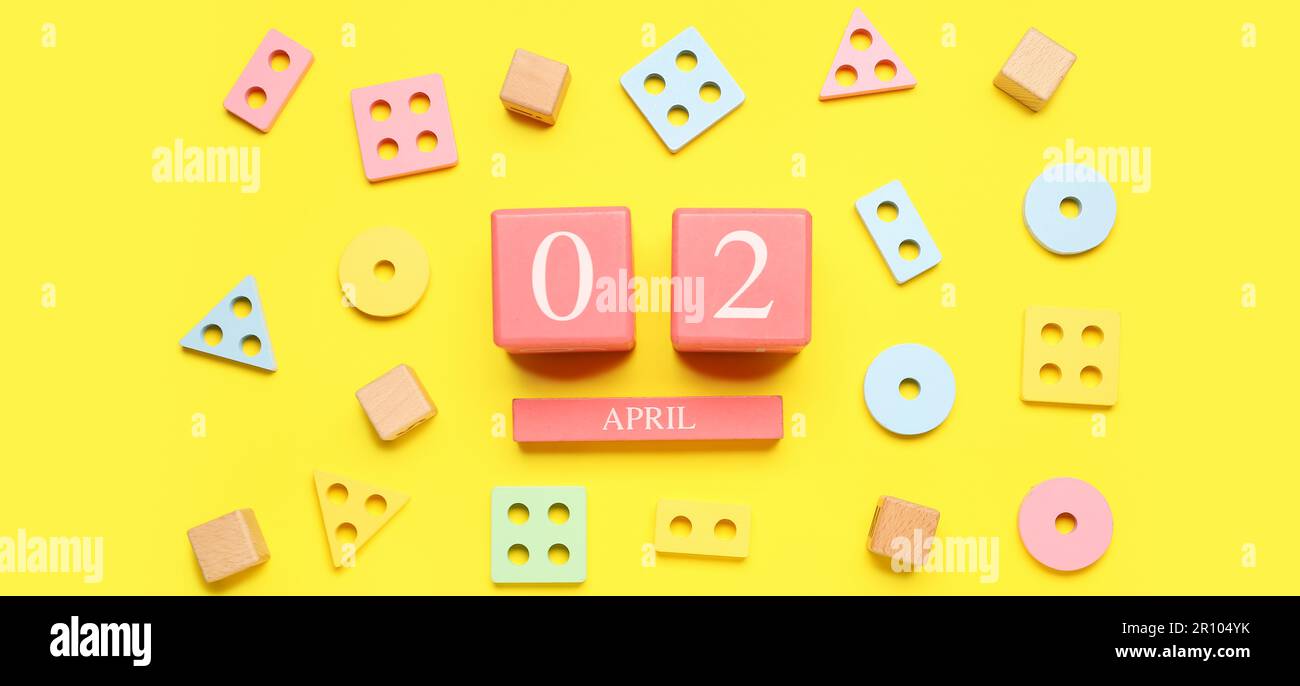Calendar with date of World Autism Awareness Day and baby toys on ...