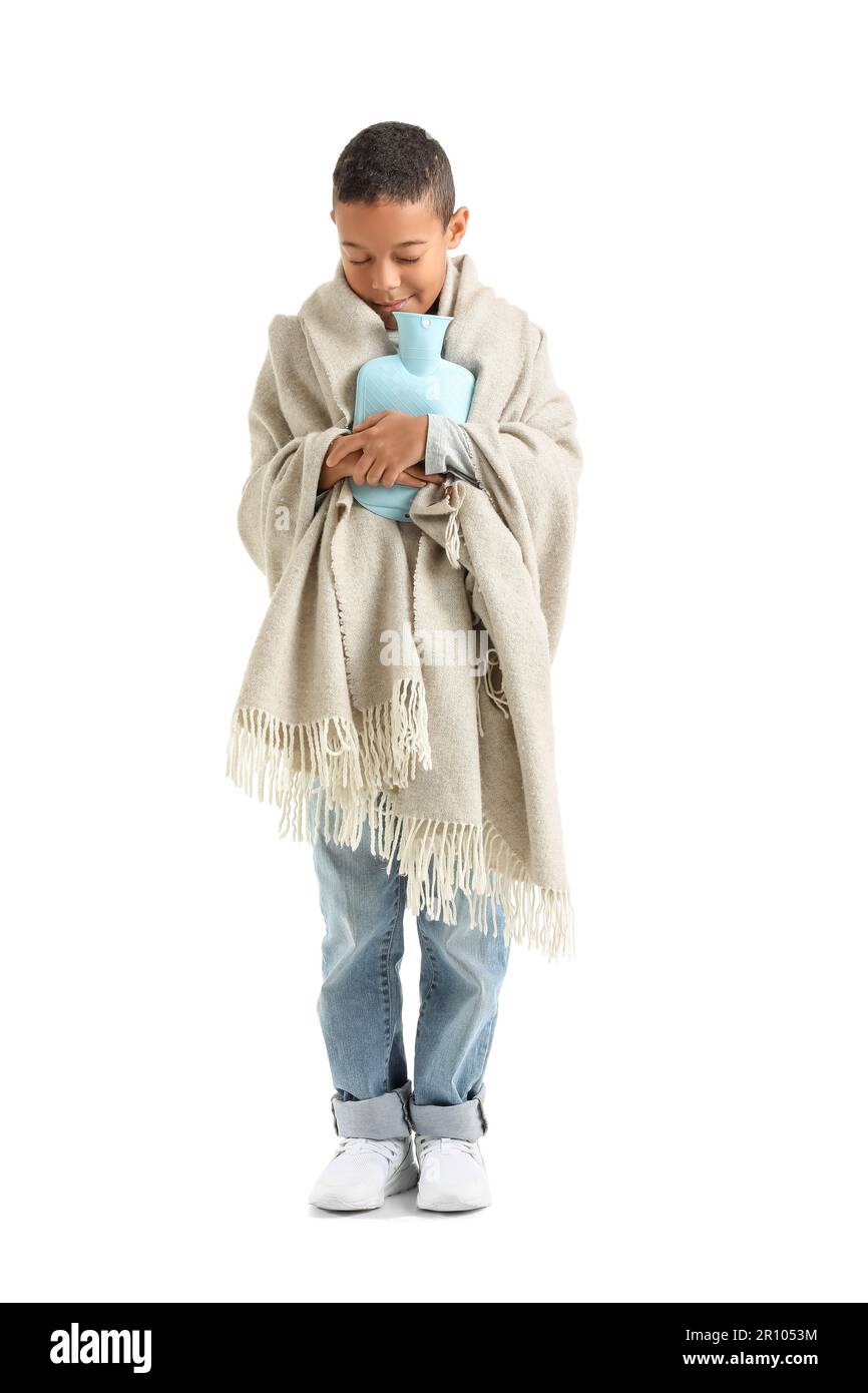 Ill African-American boy with hot water bottle on white background ...