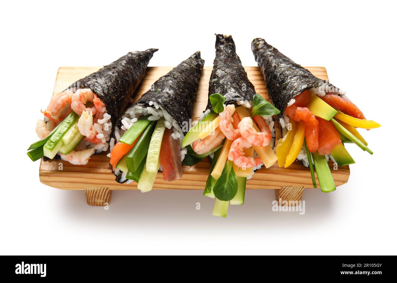 Wooden board with tasty sushi cones on white background Stock Photo - Alamy