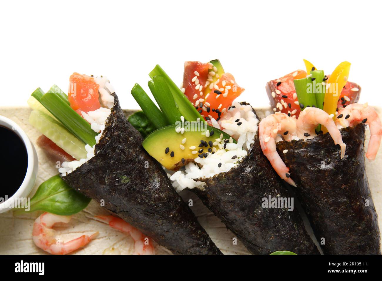 Plate with tasty sushi cones on white background, closeup Stock Photo ...