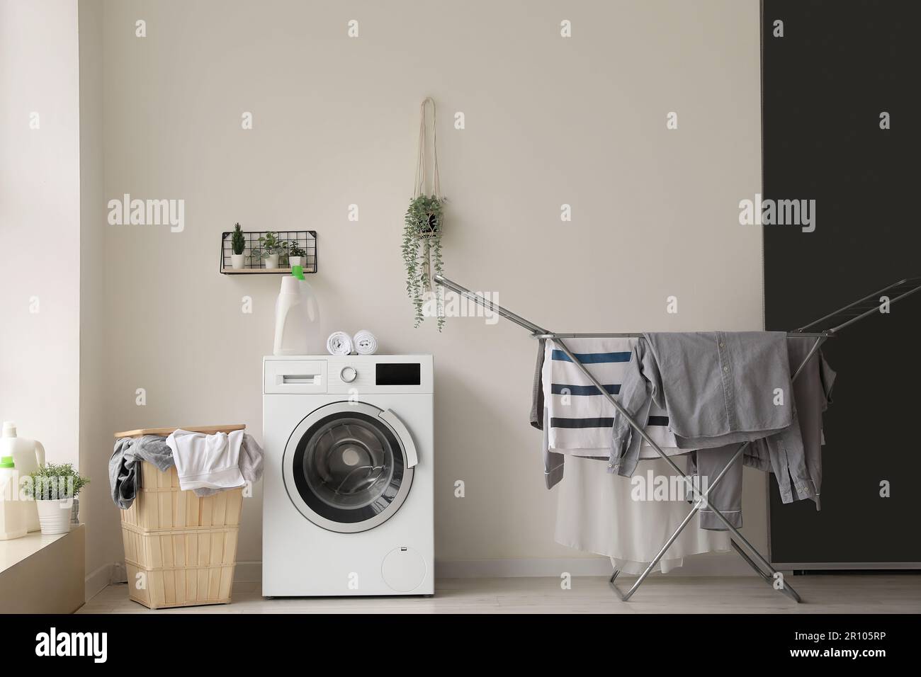 Interior of laundry room with washing machine, basket and dryer Stock ...