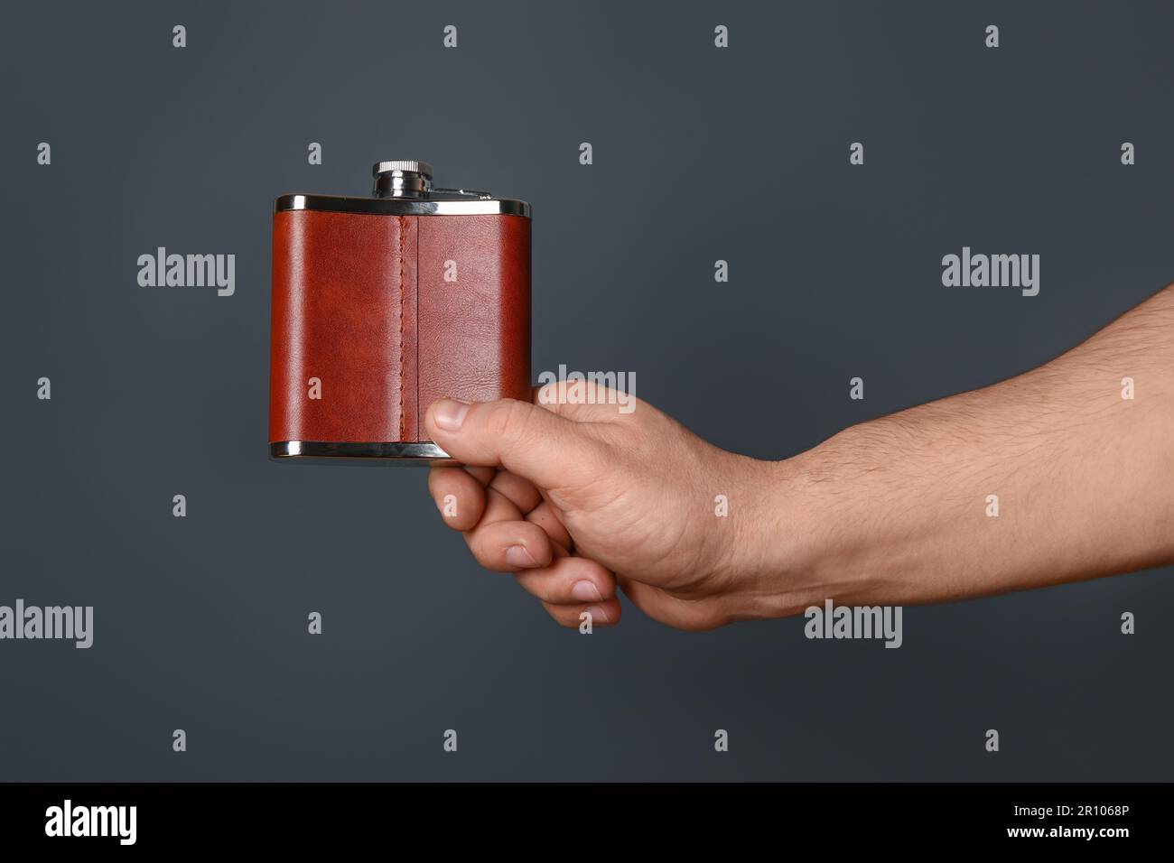 Male hand holding hip flask hi-res stock photography and images - Alamy