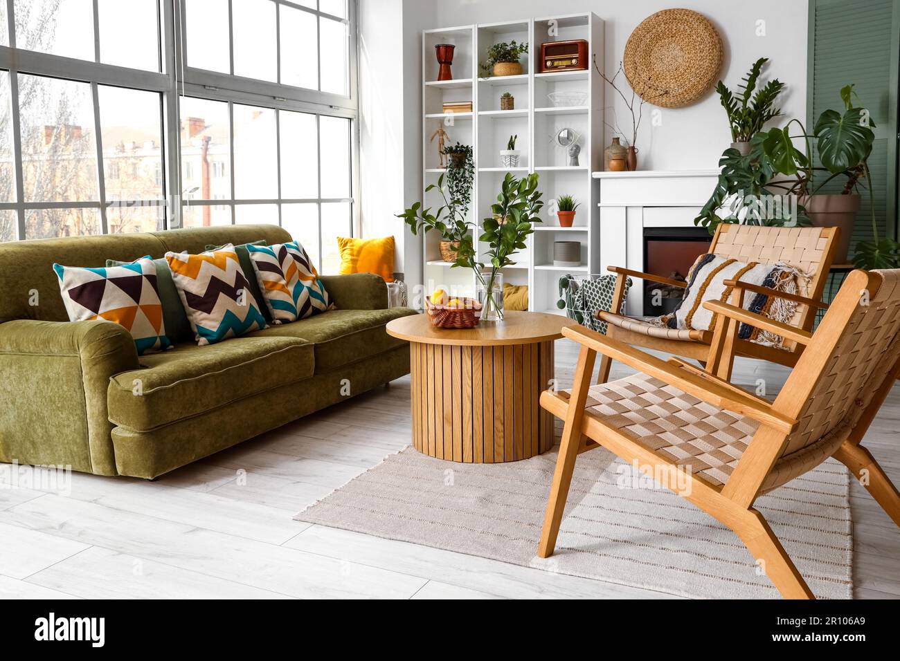 Interior of bright living room with cozy sofa, armchairs and coffee ...