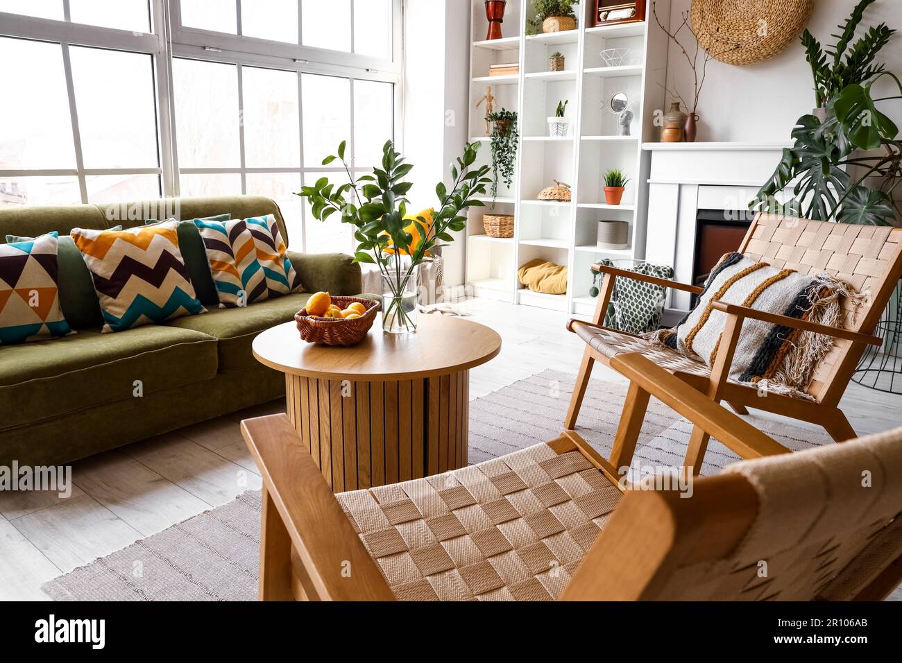 Interior of bright living room with cozy sofa, armchairs and coffee ...