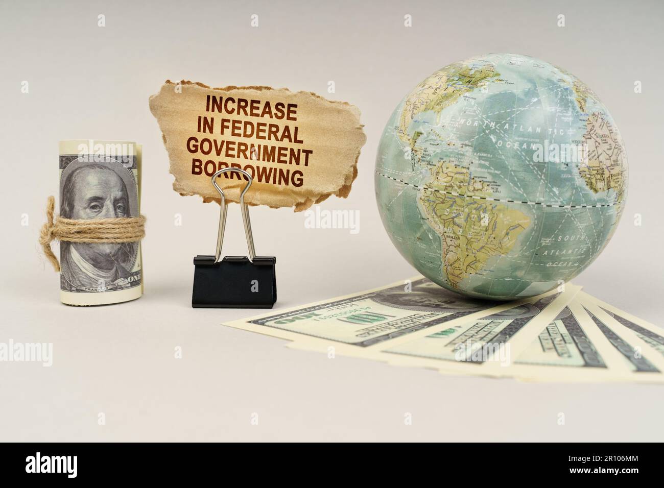 Business and finance concept. On the table are dollars, a globe and ...