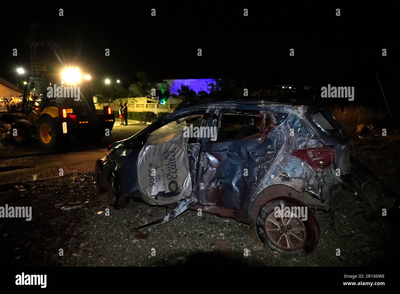 A car damaged by a rocket fired from the Gaza Strip by Palestinian ...