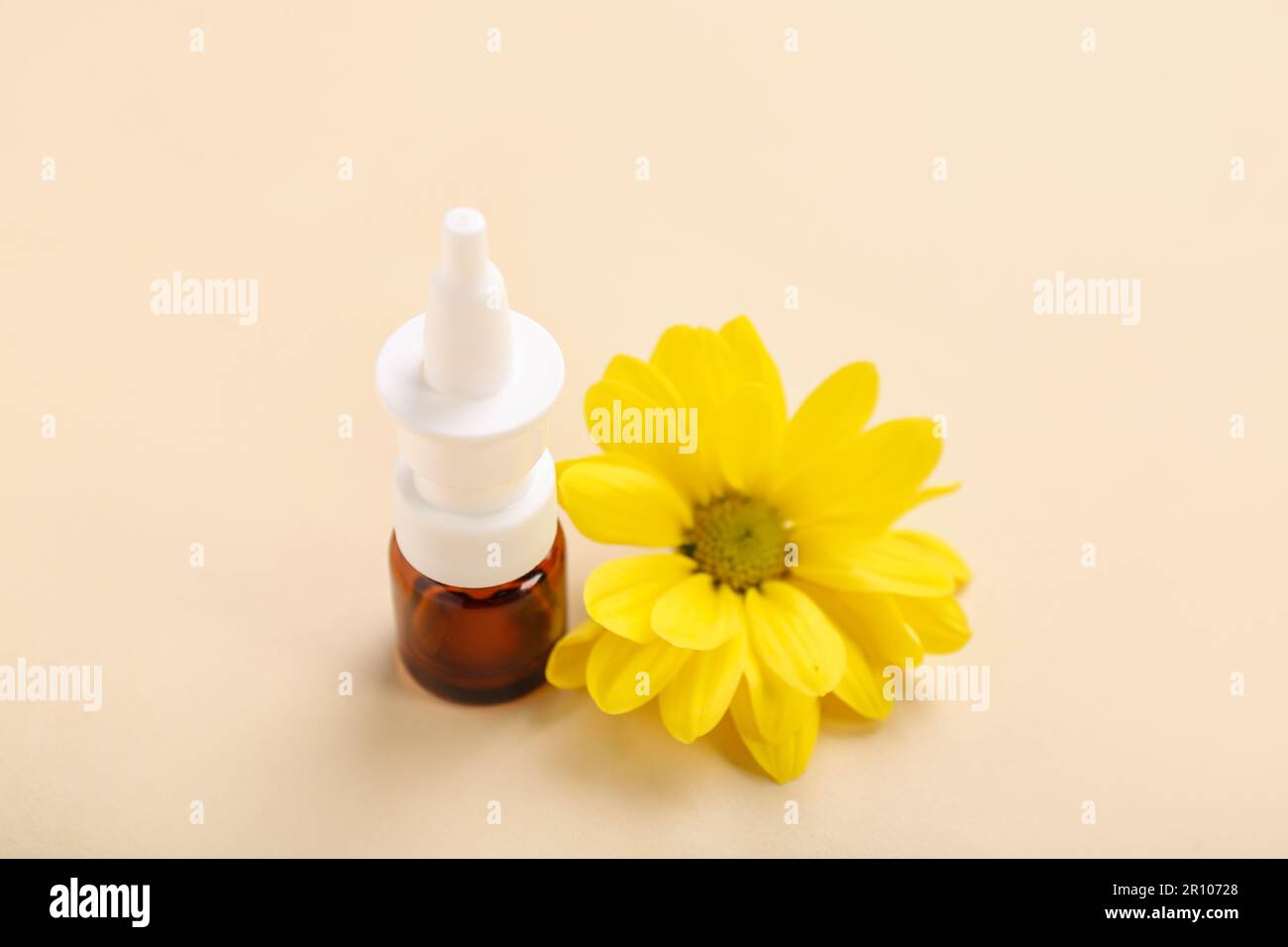 Nasal drops with daisy flower on beige background, closeup. Seasonal ...