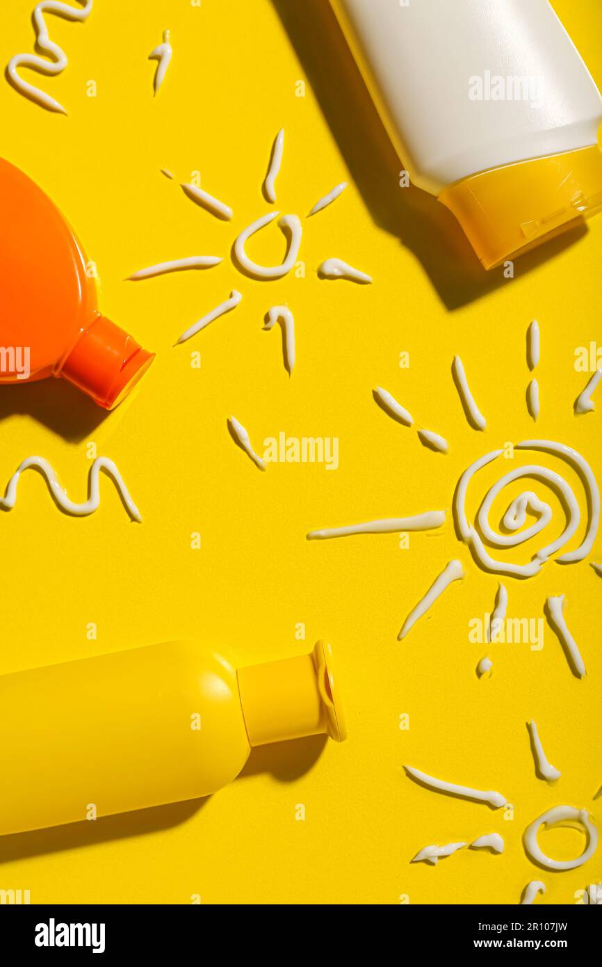 Drawings of suns made with sunscreen cream on yellow background Stock ...