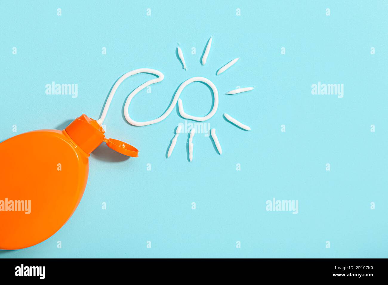 Drawings of sun made with sunscreen cream on pale blue background Stock ...