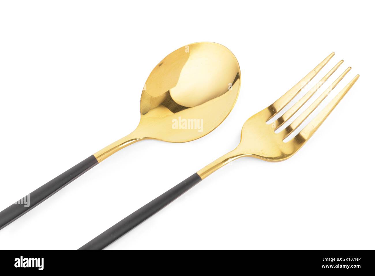 Golden spoon and fork with black handles on white background Stock ...