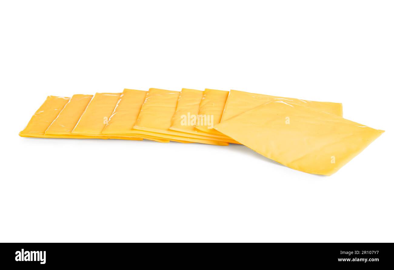 Slices of tasty processed cheese on white background Stock Photo - Alamy