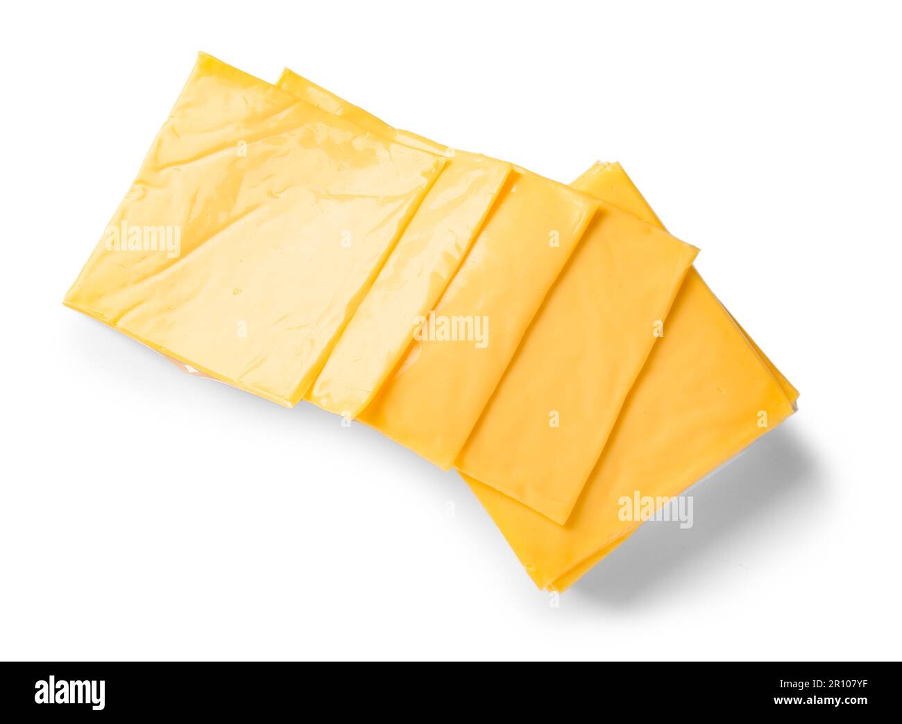 Pile of tasty processed cheese on white background Stock Photo - Alamy