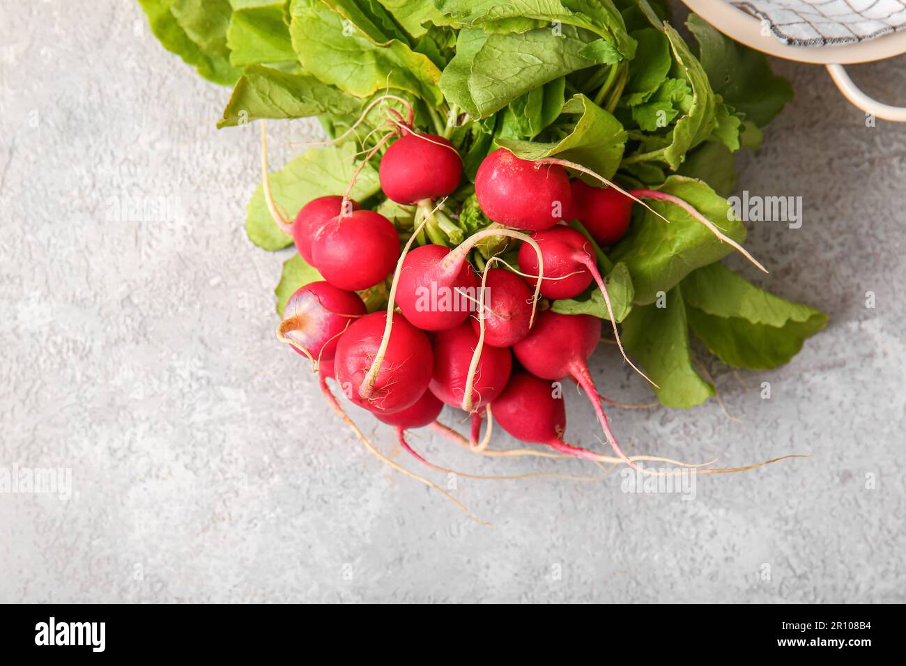 Bunch of fresh radish on light background Stock Photo - Alamy