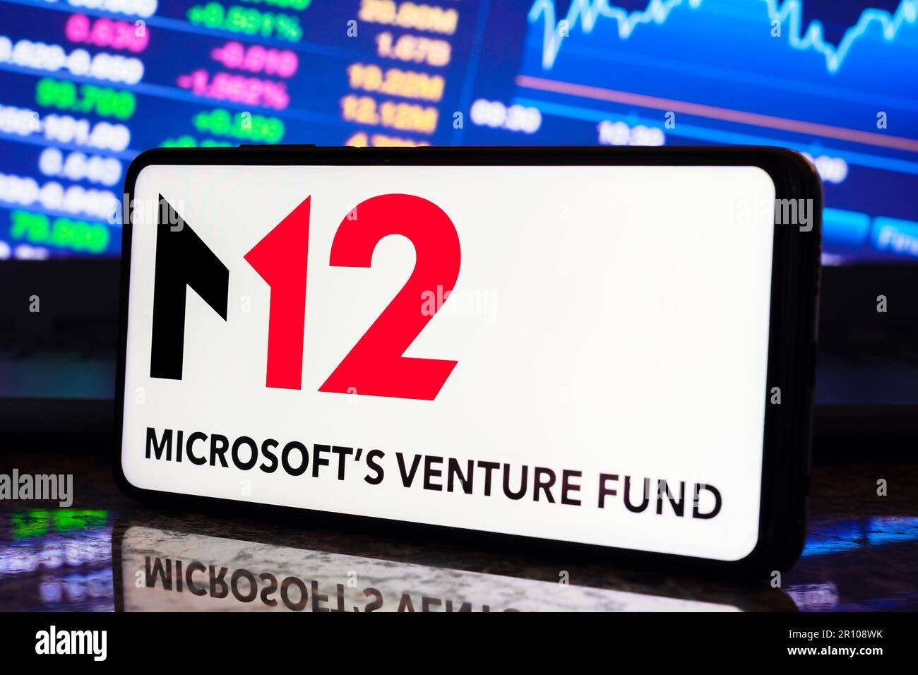 In this photo illustration, the M12 logo is displayed on a smartphone ...