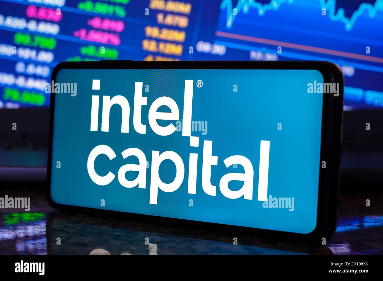 In this photo illustration, the Intel Capital logo is displayed on a ...