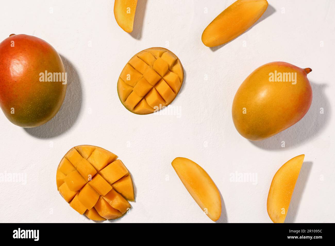Fresh ripe mangoes on white background Stock Photo - Alamy