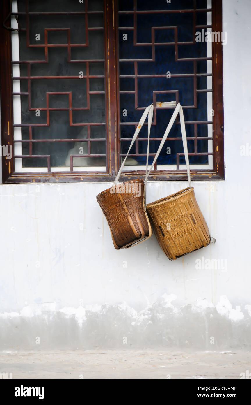 Basketss Hanging Outside of Rural Chinese Home Stock Photo - Alamy