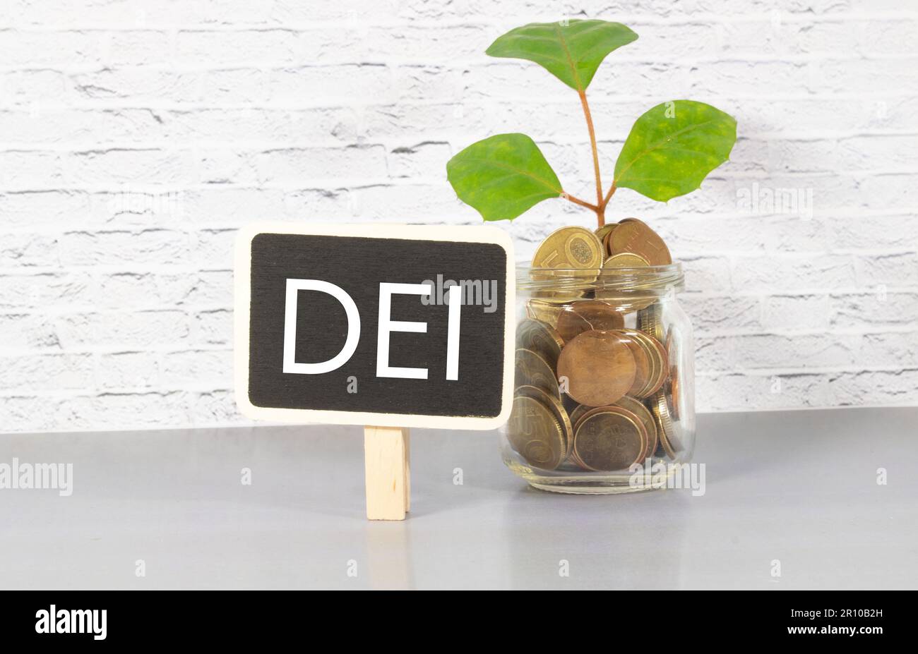 wooden blocks with text DEI on yellow background. dei - short for ...