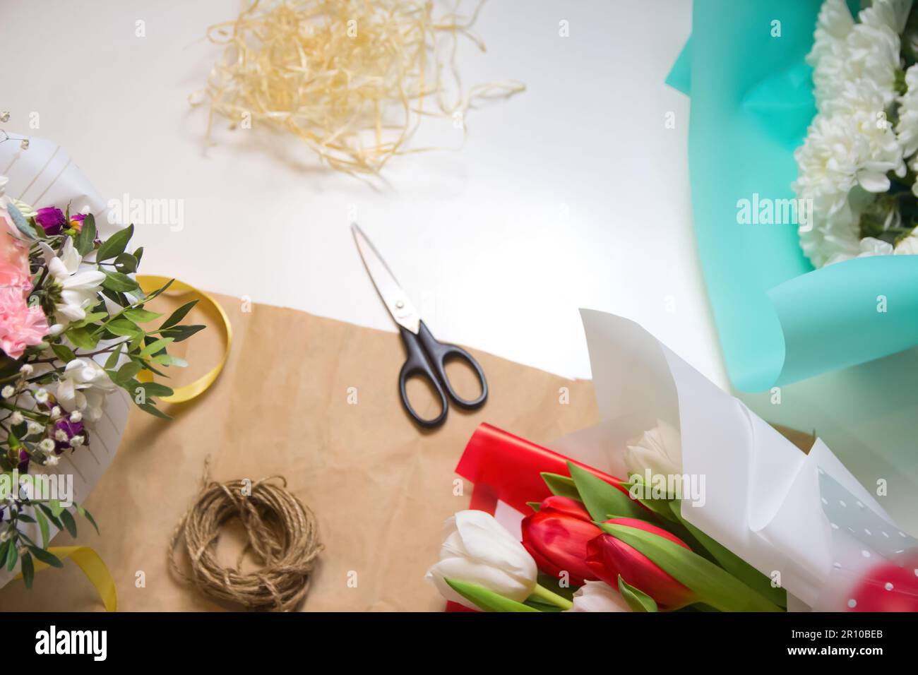 Spring background. Composition with flowers and rope on craft pa Stock ...
