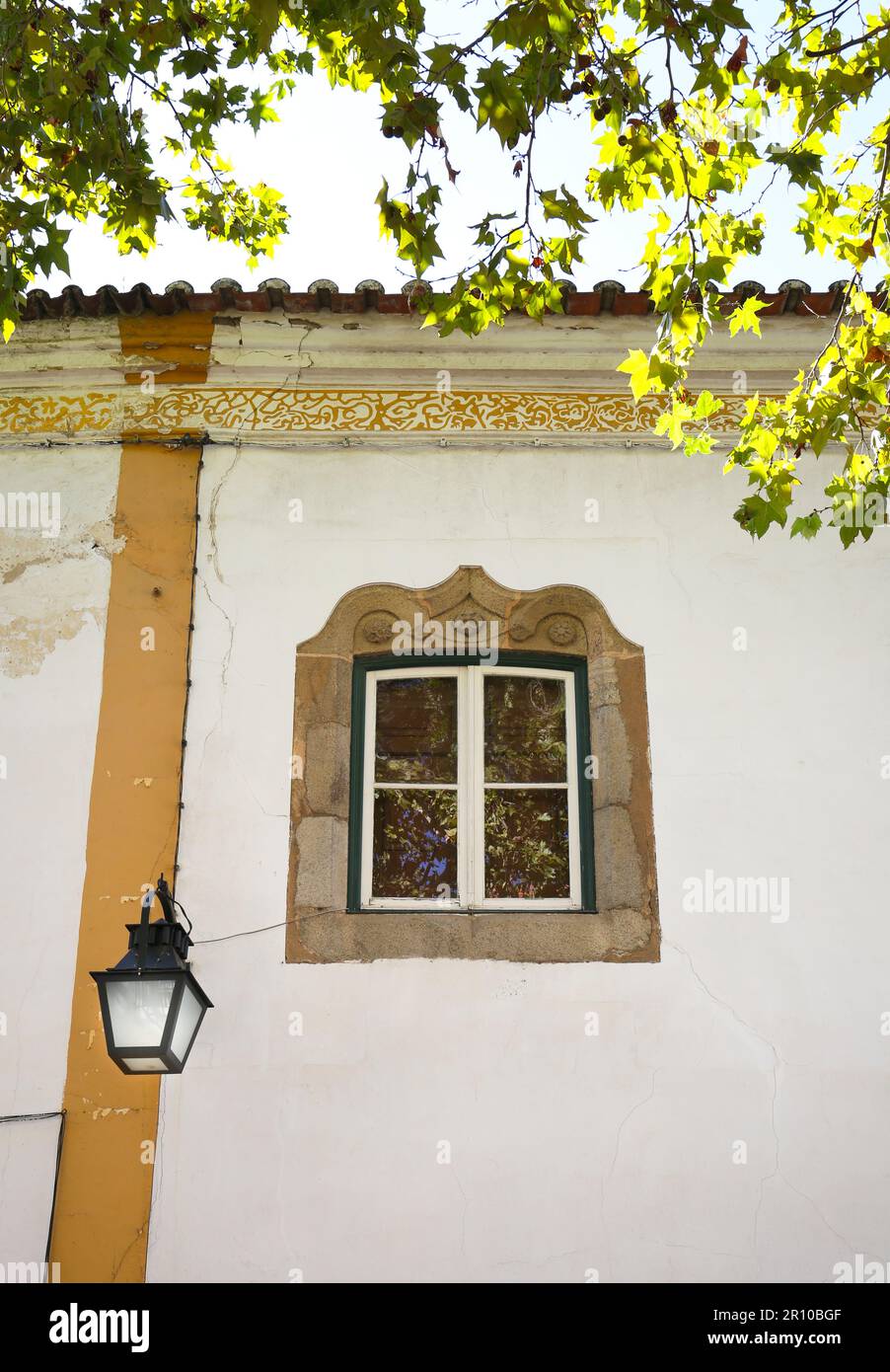 Typical Portuguese facade with arabic style window in Evora town Stock ...